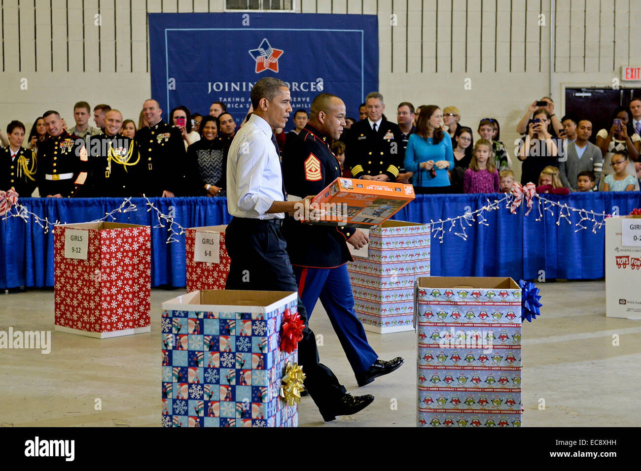 US President Barack Obama helps sort toys during the Marine Corps' Toys ...