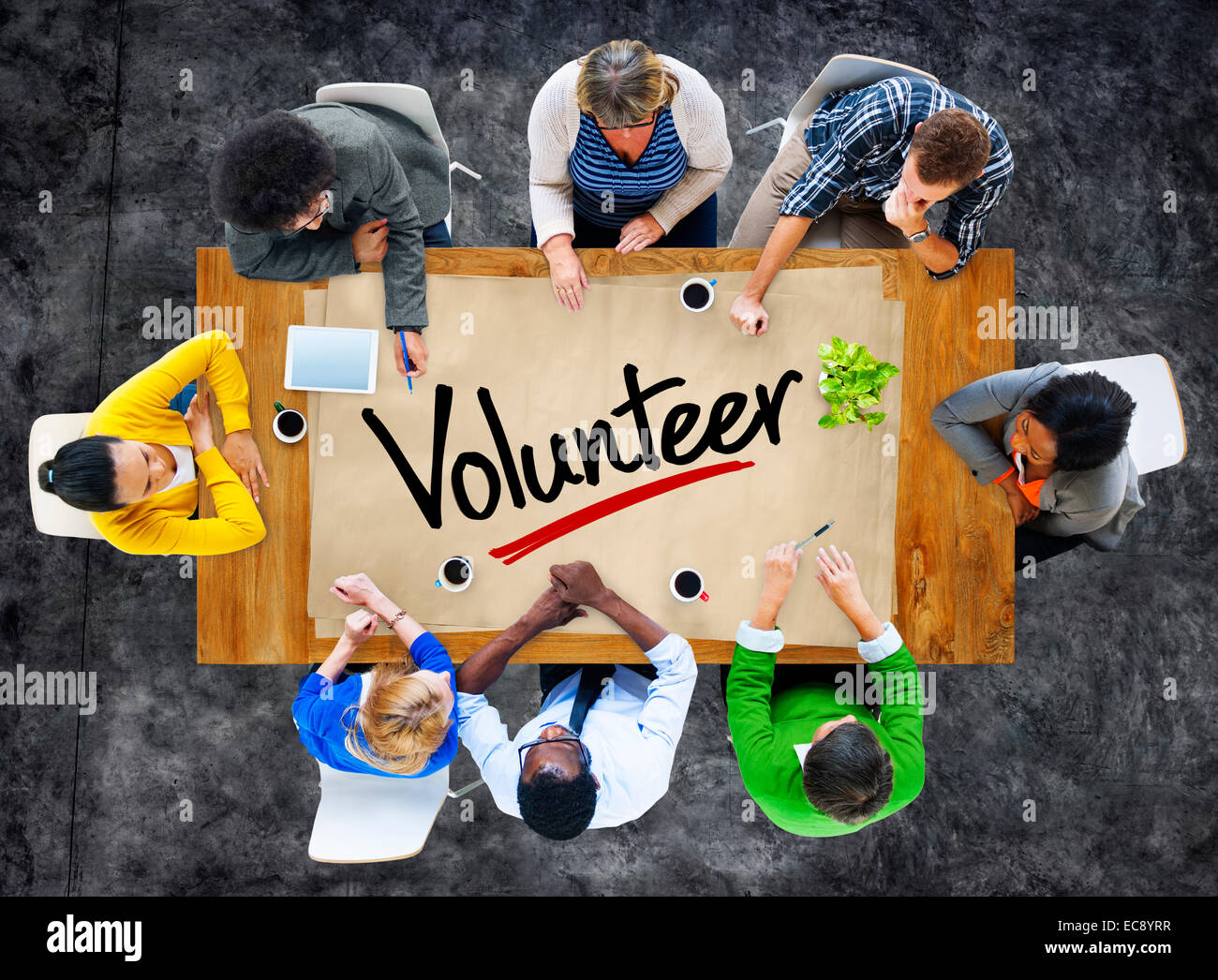 People in a Meeting and Single Word Volunteer Stock Photo - Alamy