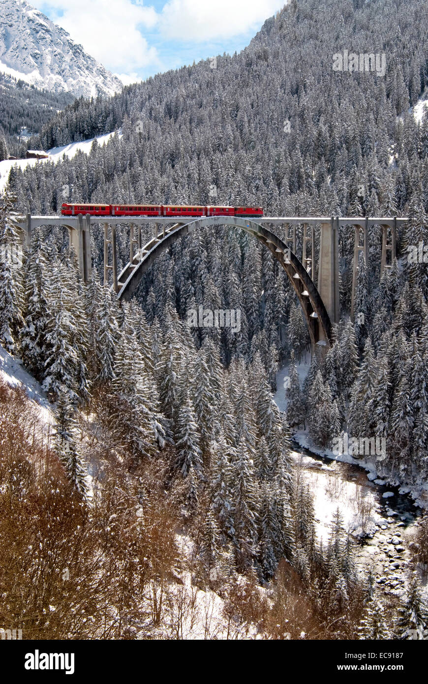 Arosa train on the Langwies Viaduct in a beautiful mountain landscape ...