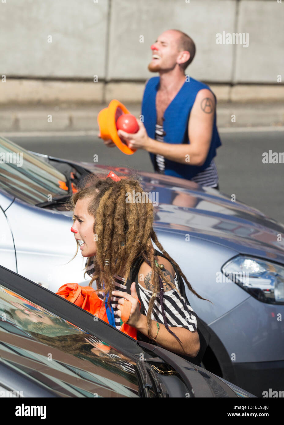 Busking at traffic lights hi-res stock photography and images - Alamy