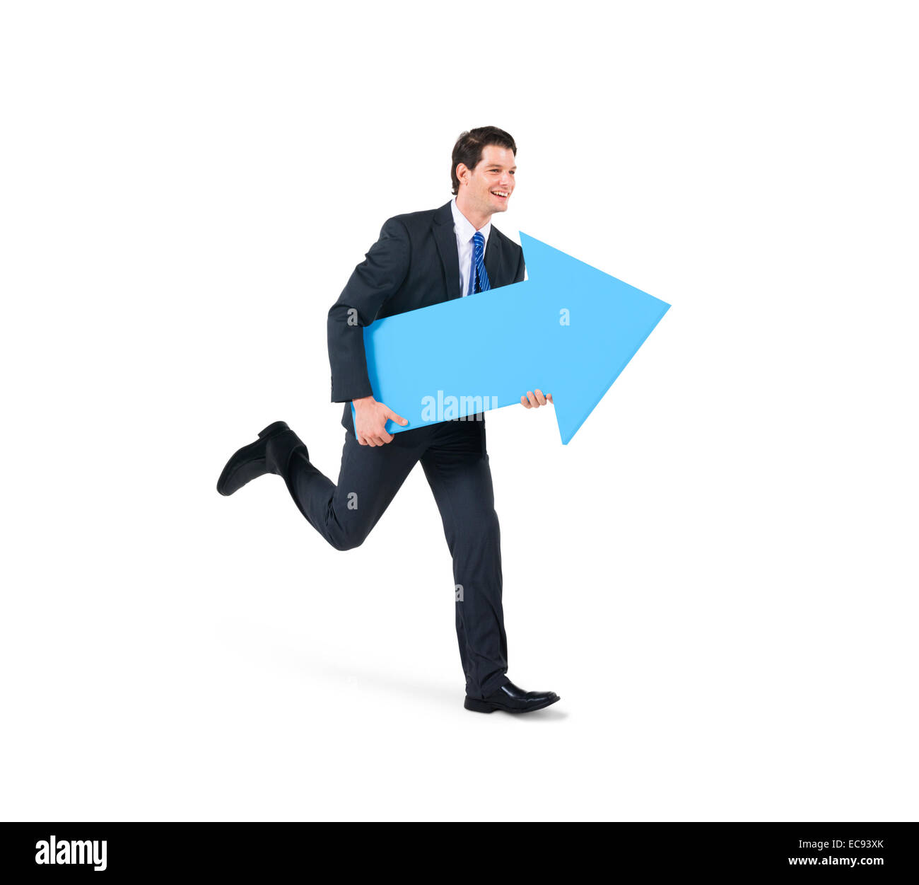 Happy Business Man Posing With An Arrow Sign Stock Photo - Alamy