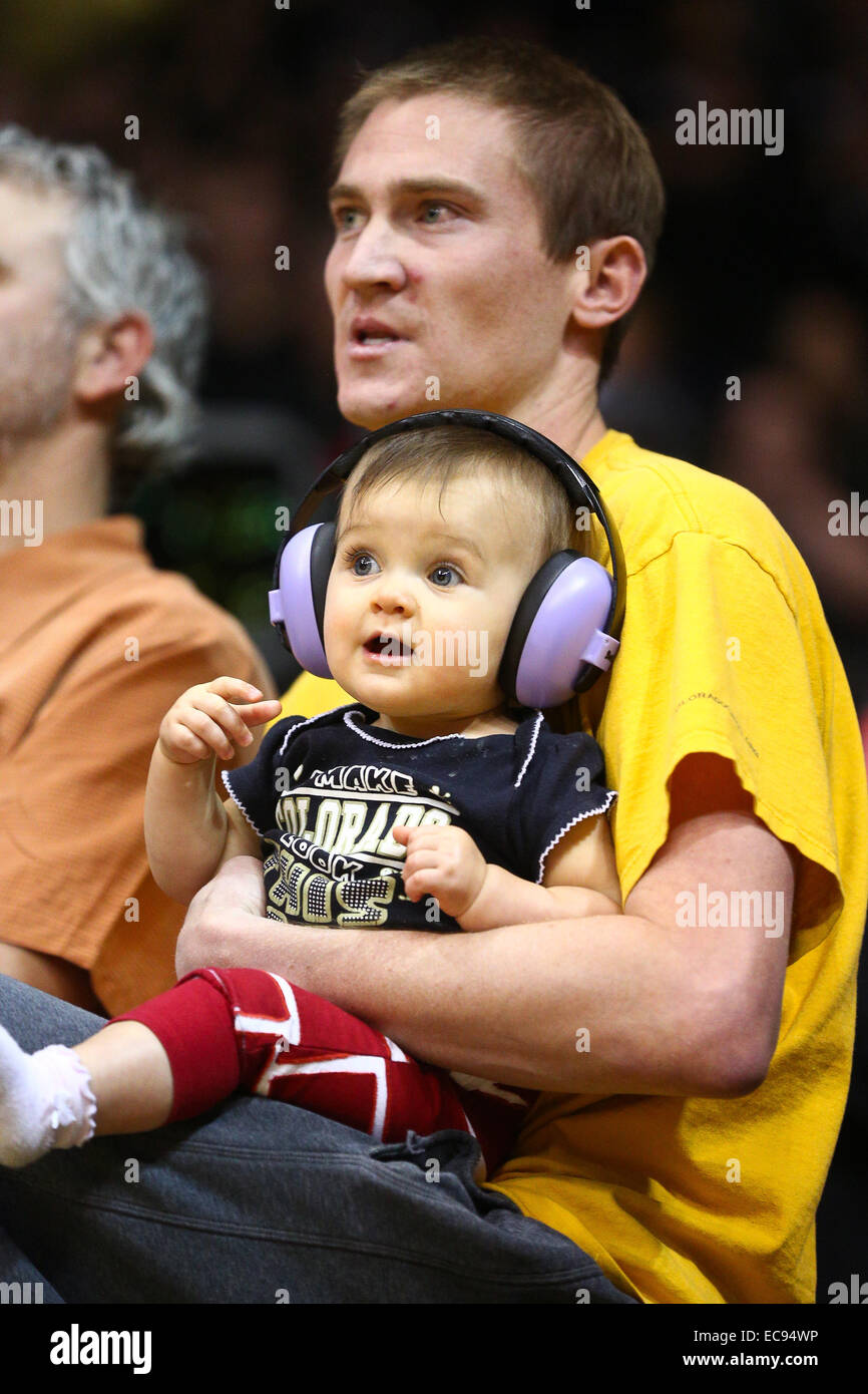 Boulder. 10th Dec, 2014. A young Colorado basketball fan cheers on his ...