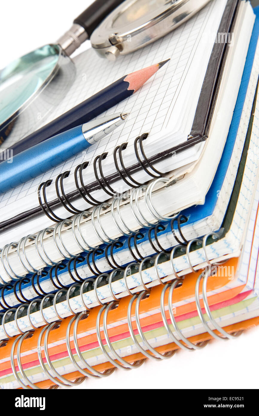 pen and watch on checked notebook isolated on white background Stock ...