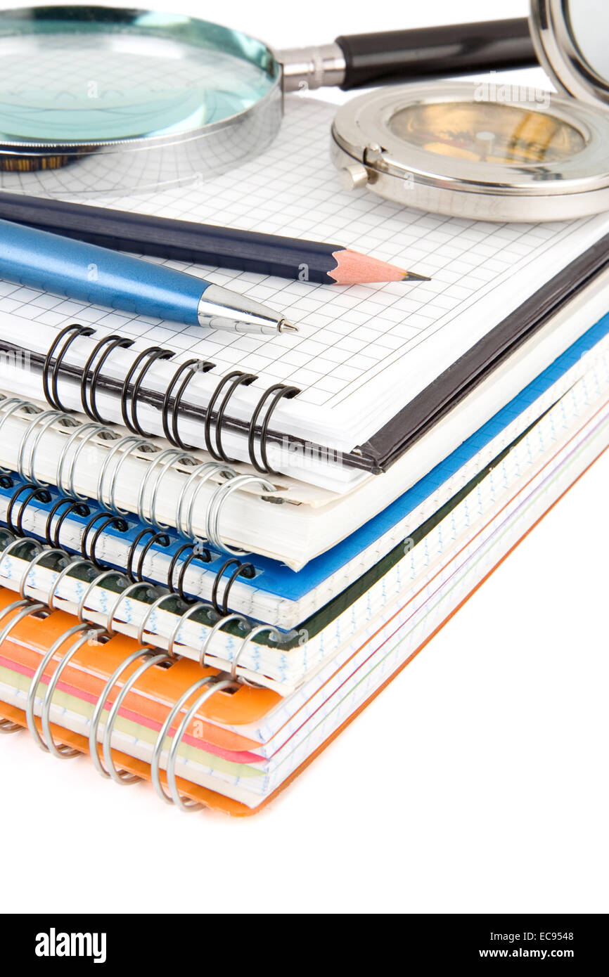 pen and pencil at pile of notebook isolated on white background Stock ...