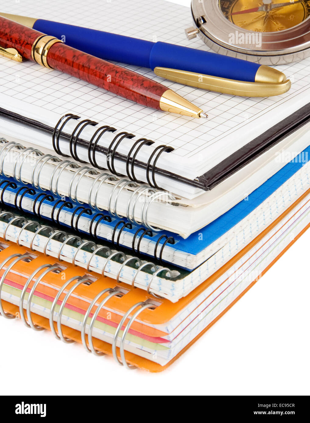 pen and pencil at pile of notebook isolated on white background Stock ...