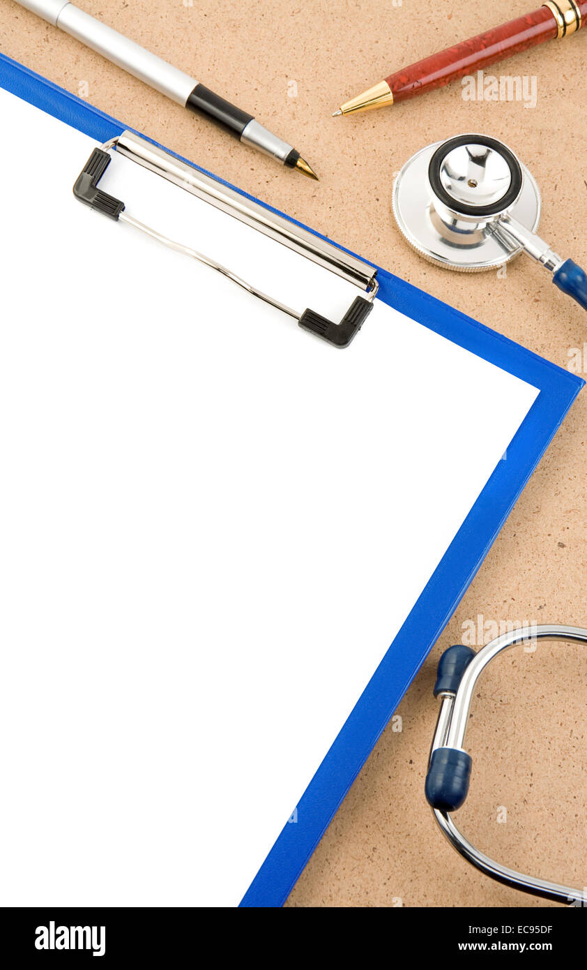 medical stethoscope with form blank on wood and pen Stock Photo - Alamy