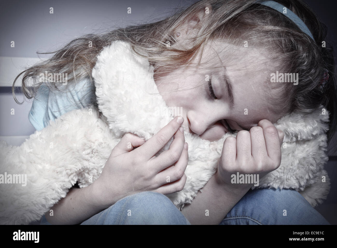 Child crying parents hug hi-res stock photography and images - Alamy