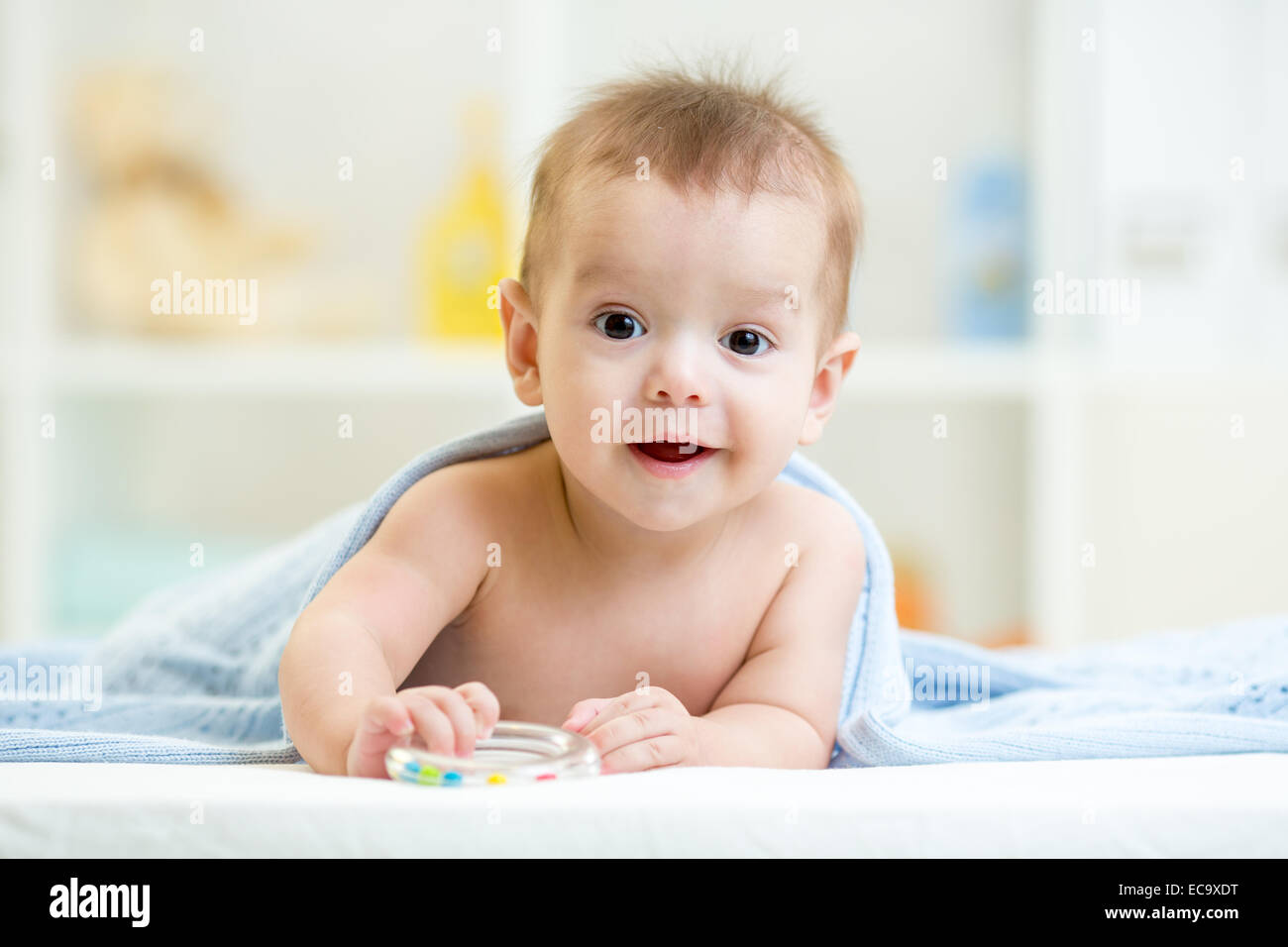 Baby under blanket hi-res stock photography and images - Alamy