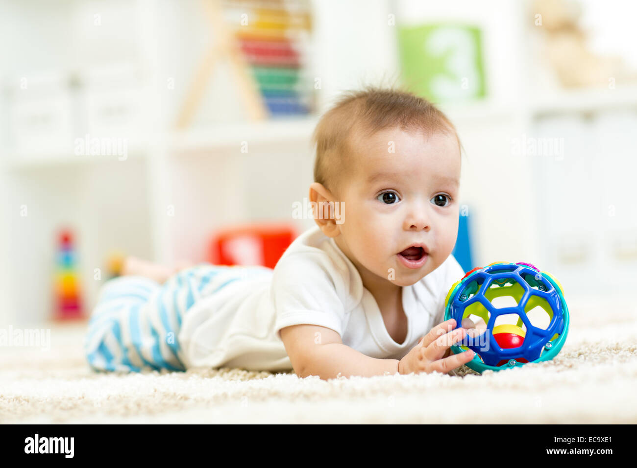 baby boy playing with toy at home Stock Photo - Alamy