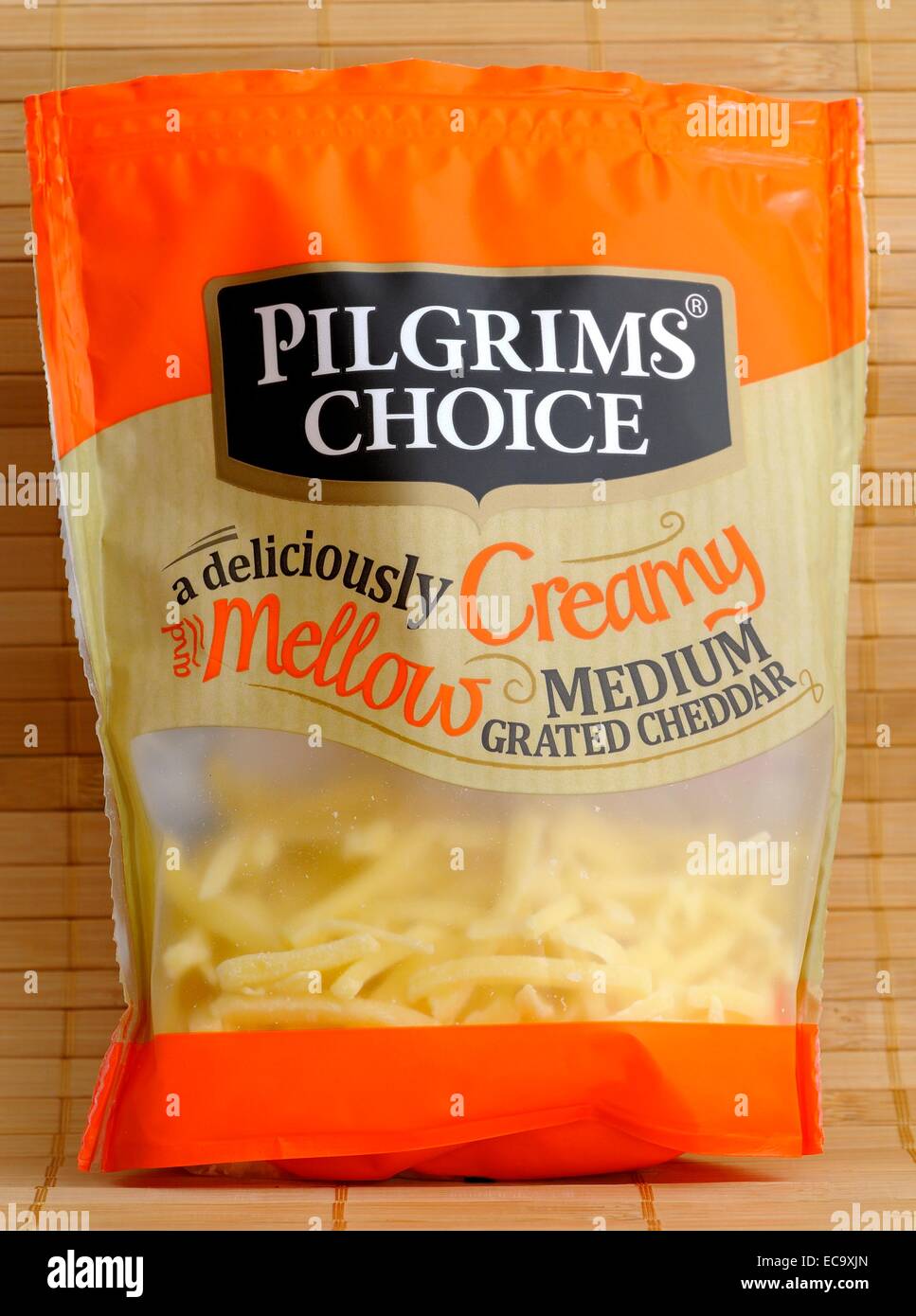 Pilgrims Choice creamy mellow grated medium cheddar Stock Photo - Alamy