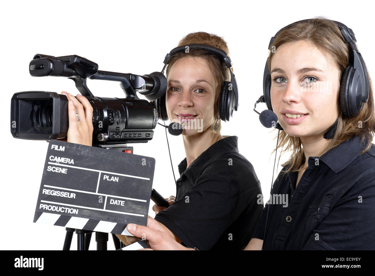 two young women with a video camera and a clapper board Stock Photo - Alamy