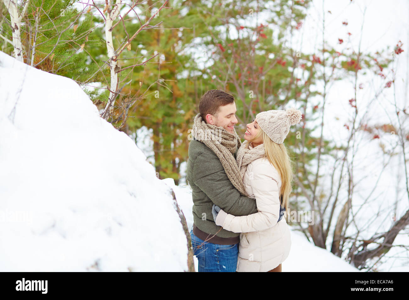 Young amorous dates looking at one another in natural environment Stock ...