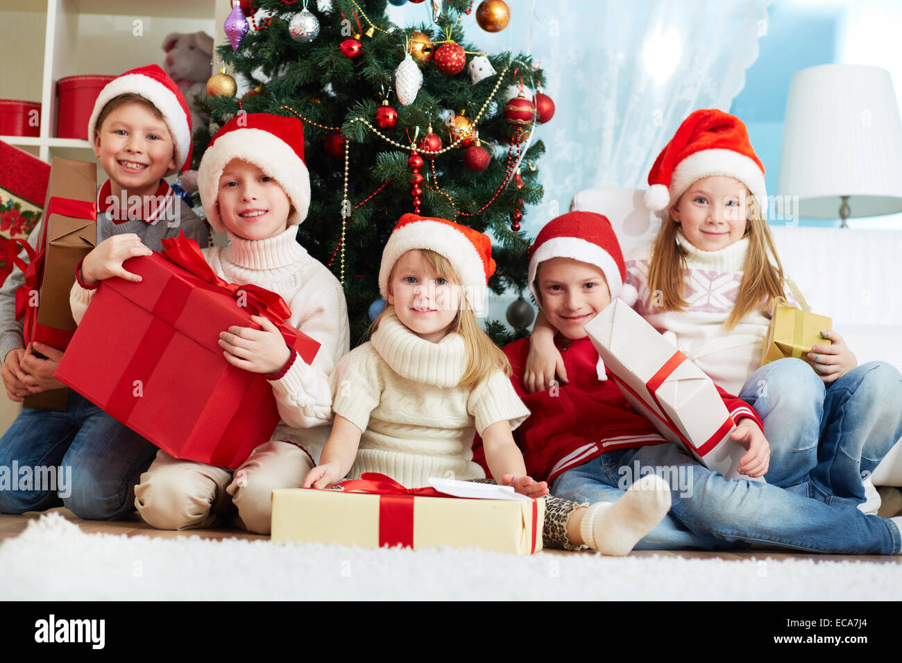 Kids in santa caps hi-res stock photography and images - Alamy