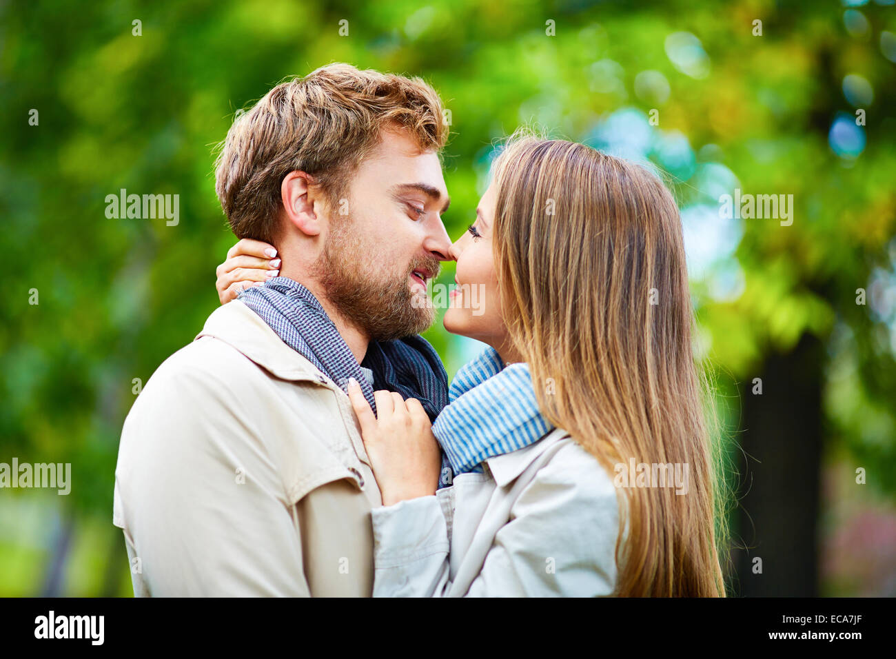 Romantic couple looking at one another in embrace Stock Photo - Alamy