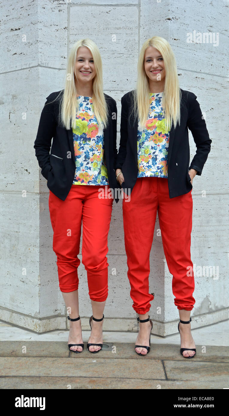 Portrait of twin sisters from Germany dressed identically. At Fashion ...