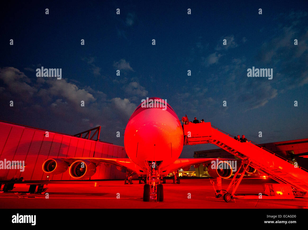 The first Airbus A380 stands engulfed in red light on its parking ...