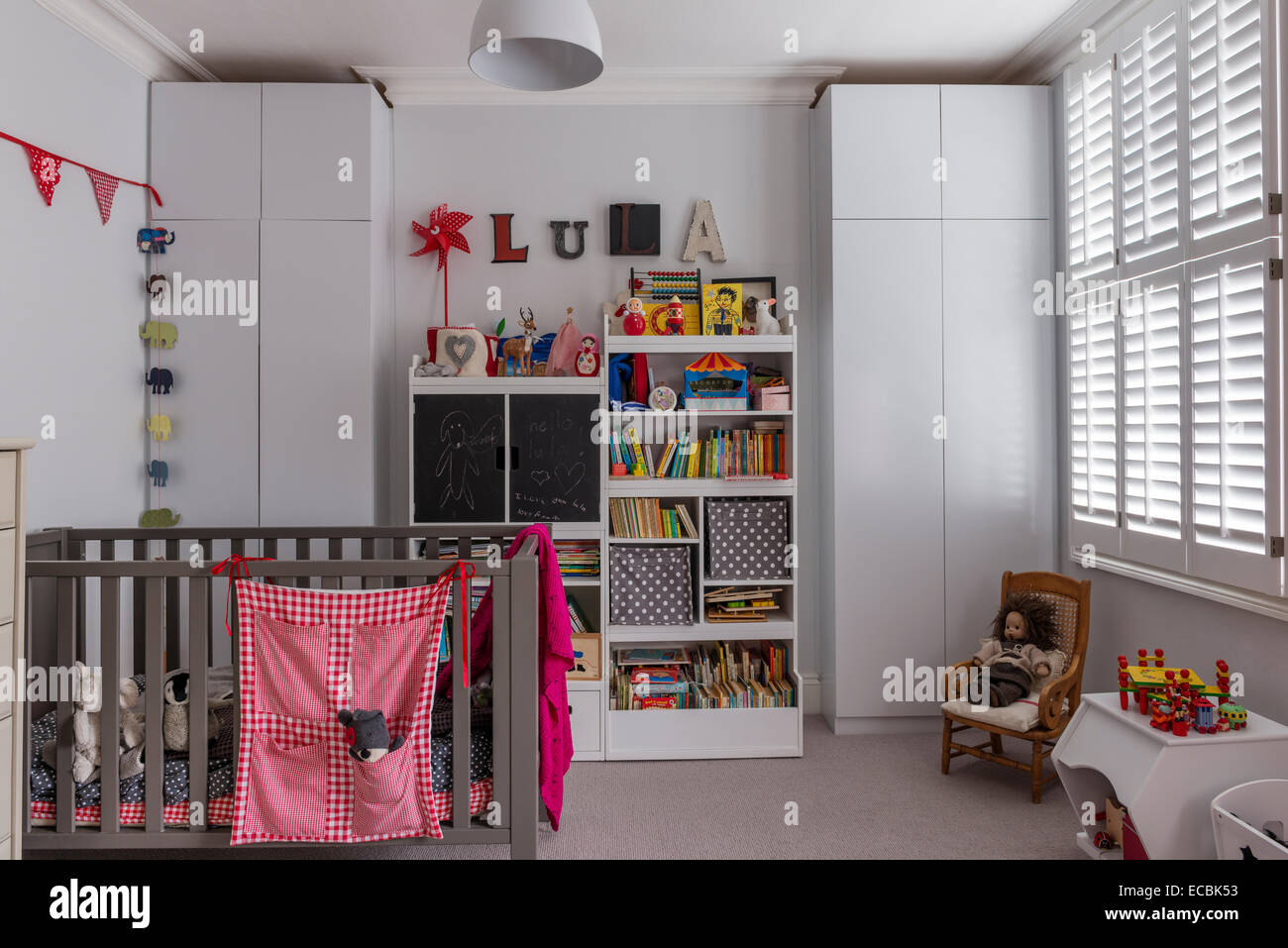 Childs bedroom with cot and inbuilt storage Stock Photo - Alamy