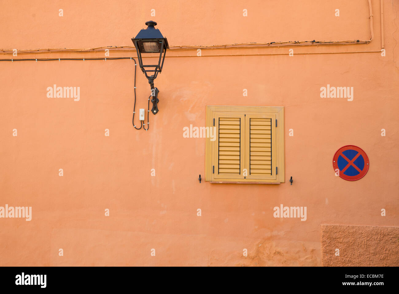 Old house facade with a street lamp and a traffic sign Stock Photo - Alamy