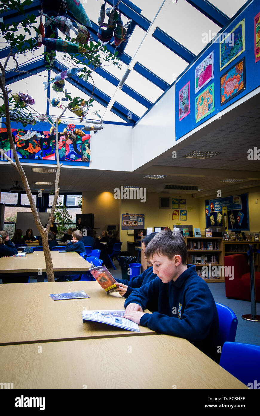 Children reading in new library with atrium Stock Photo - Alamy