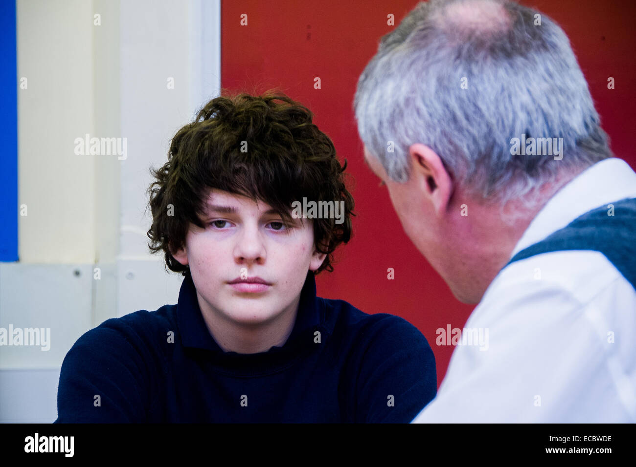 Student being told off by teacher in class,uk Stock Photo - Alamy
