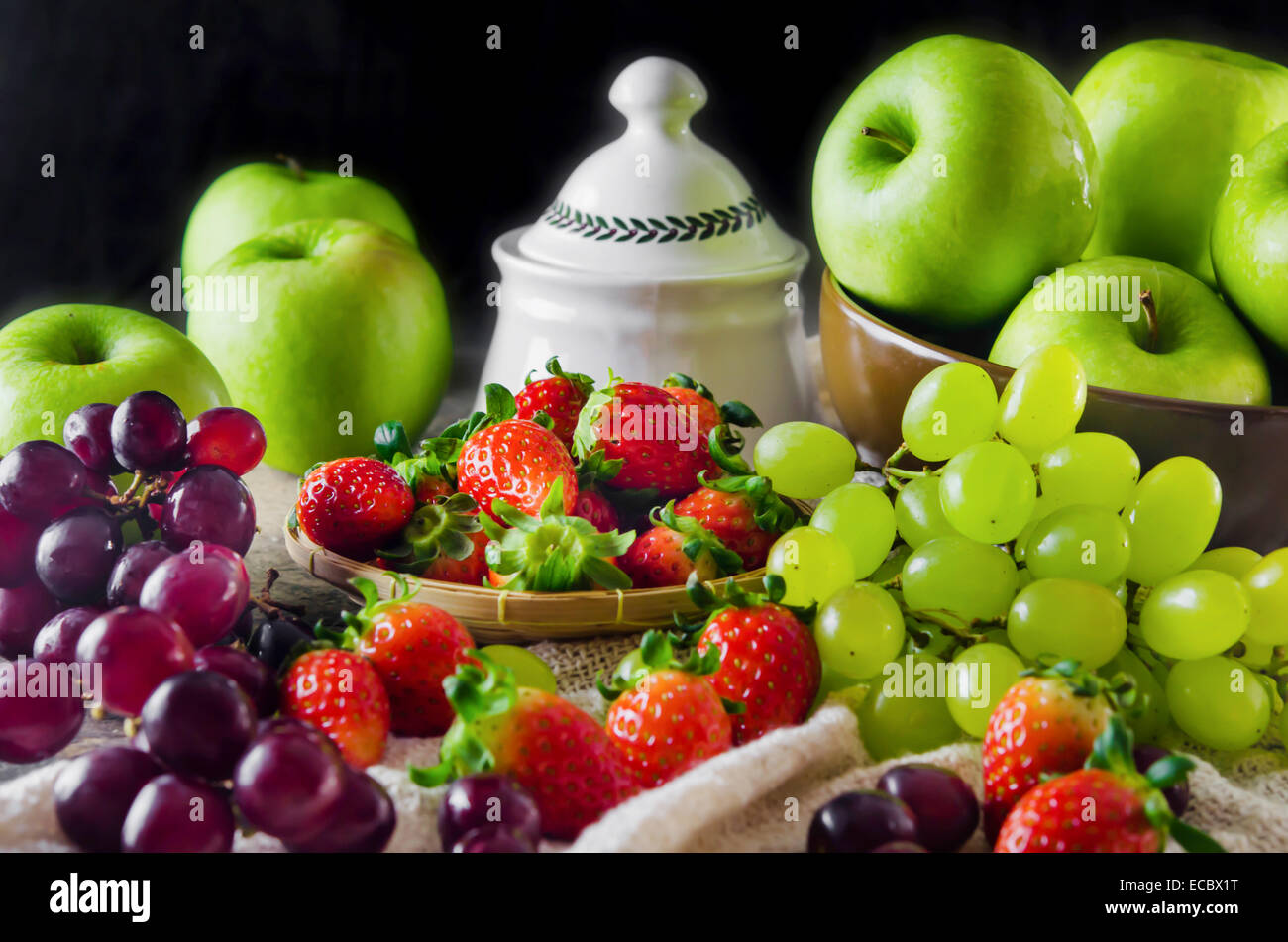 still life of mix fruits , apple with strawberry, pineapple and banana ...