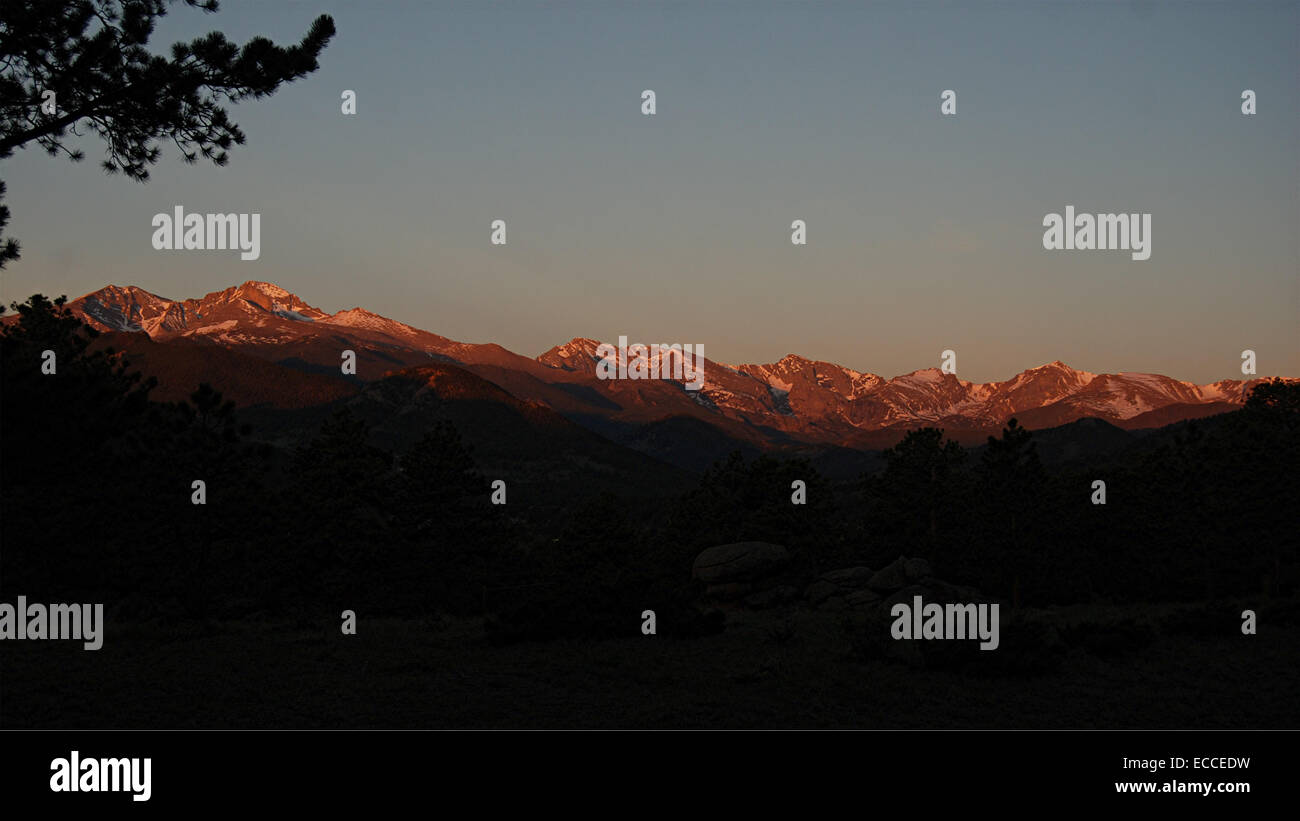 Alpenglow paints the sky over Rocky Mountain National Park on June 10 ...
