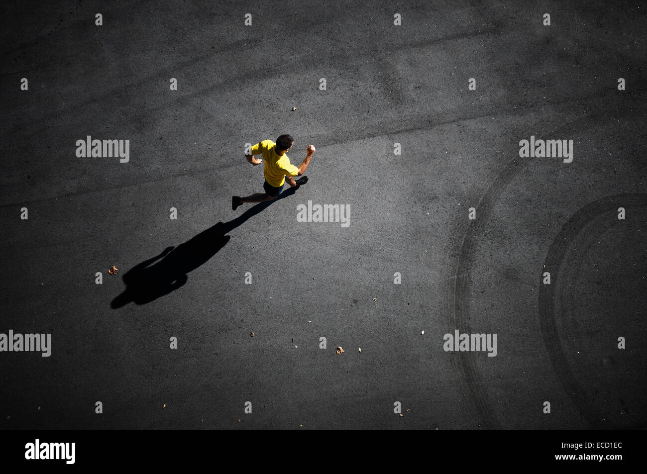 A male runner and his shadow Stock Photo - Alamy
