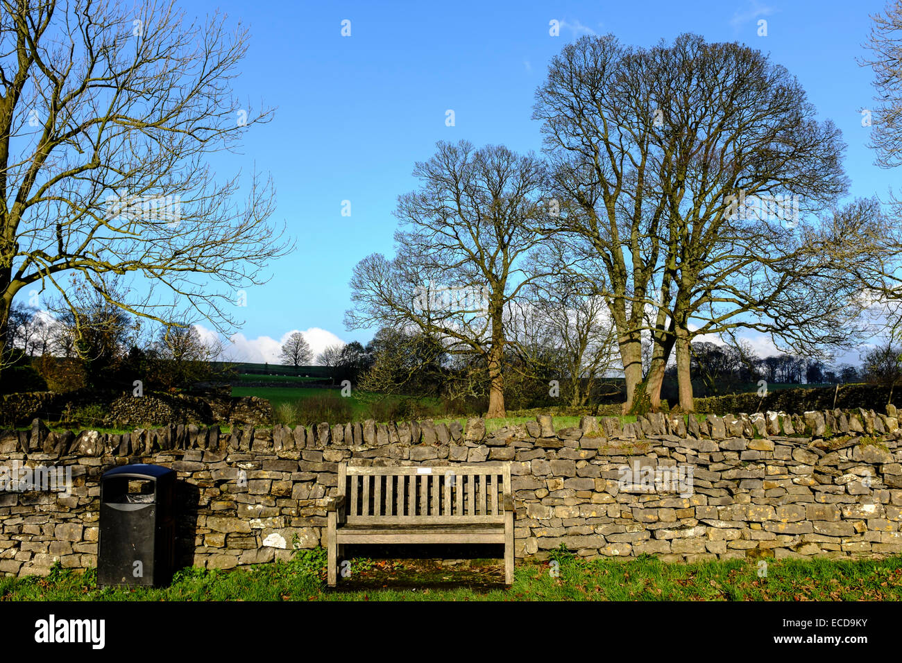 A bench, dry stone wall and waste bin in a rural autumnal setting Stock ...