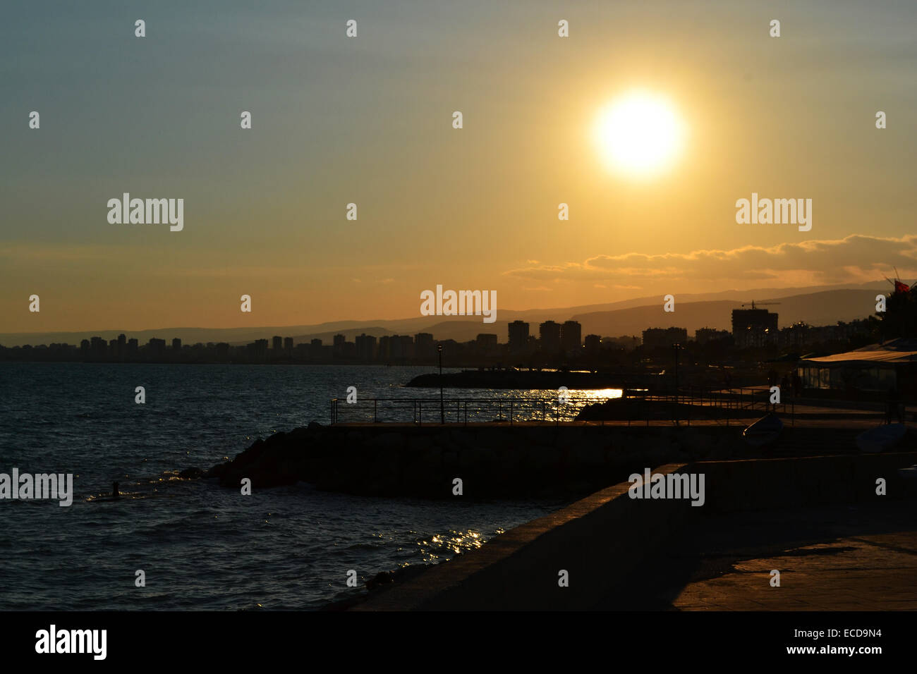 A view of the sea and the city on sunset Stock Photo - Alamy