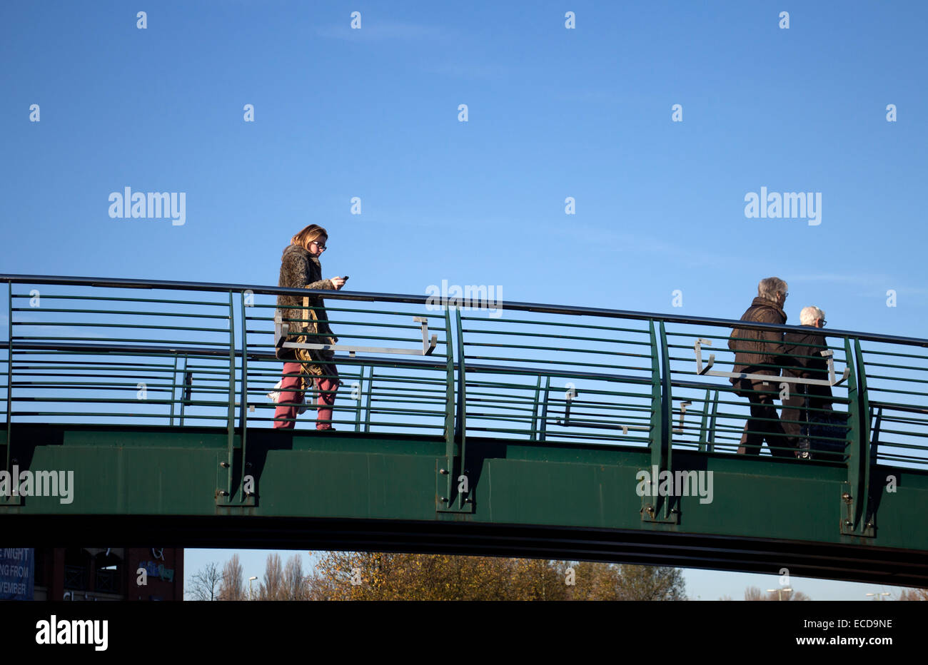 People walking over the footbridge hi-res stock photography and images ...