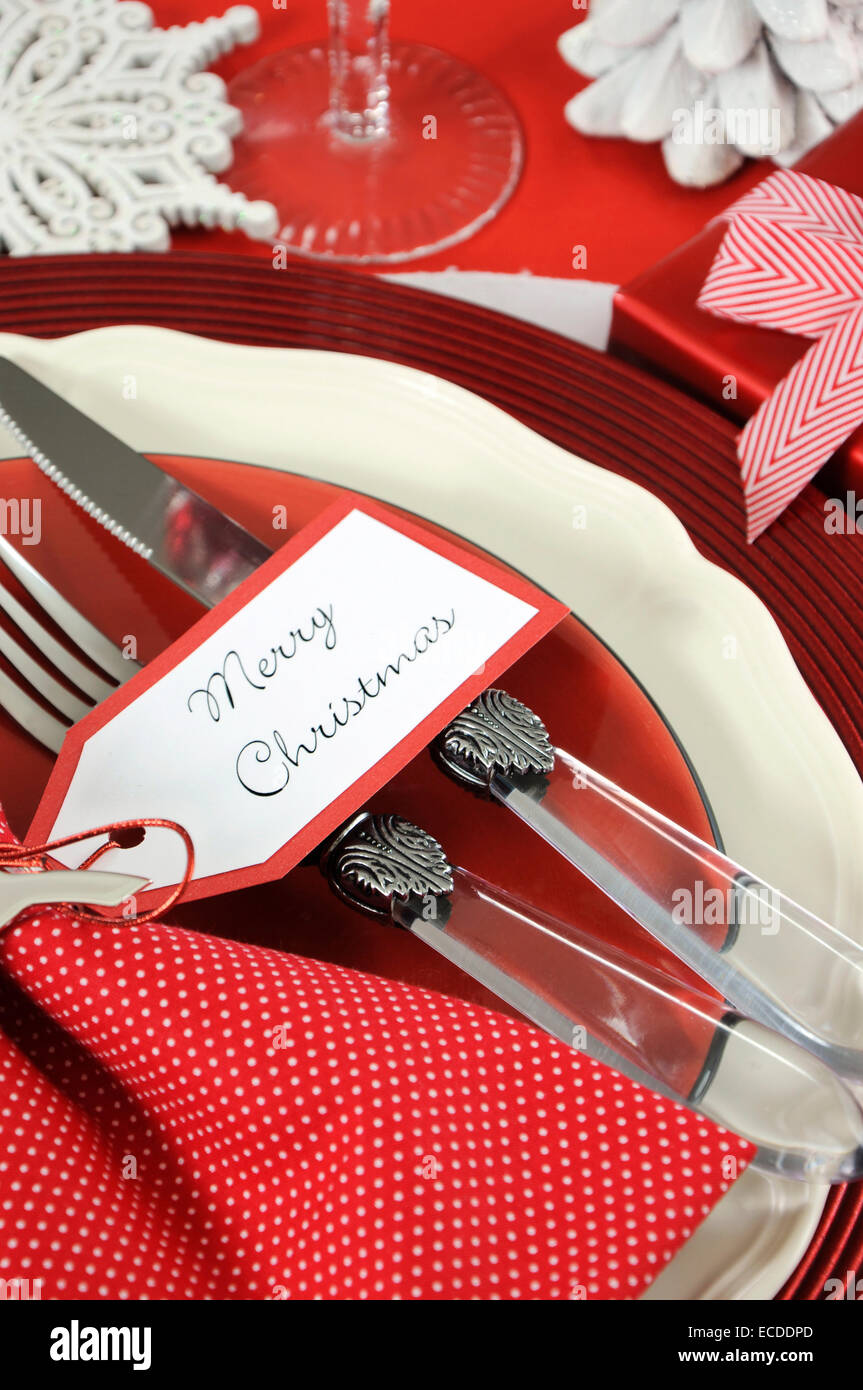 Modern Christmas table place settings in red and white theme. Closeup ...
