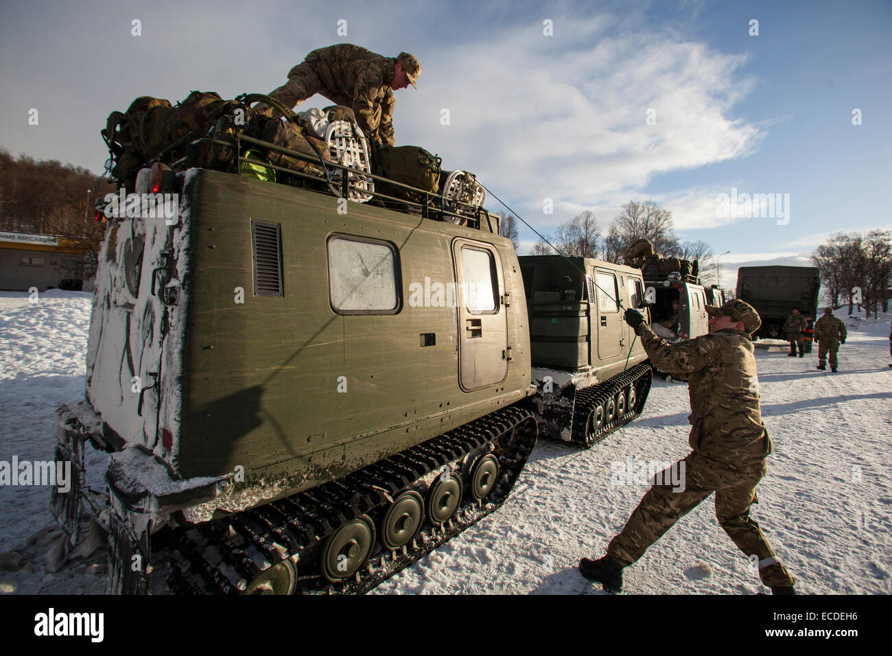 British Royal Marines secure gear atop a BV track vehicle before ...