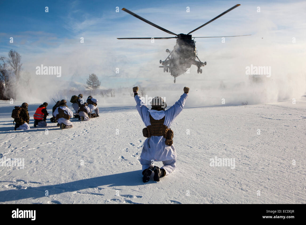 A NATO helicopter blows snow while landing to retrieve Norwegian Army ...