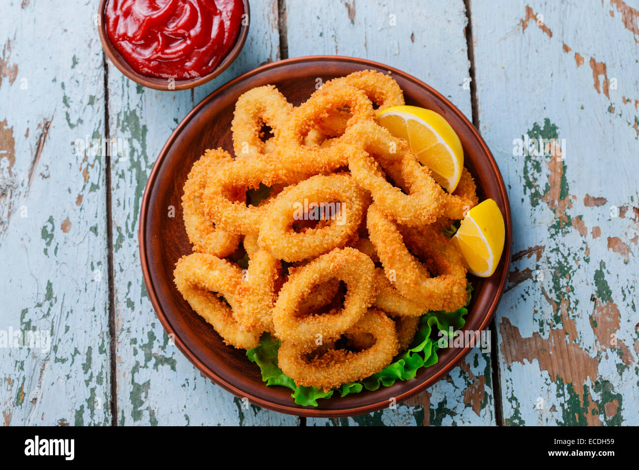 fried squid rings breaded with lemon Stock Photo - Alamy