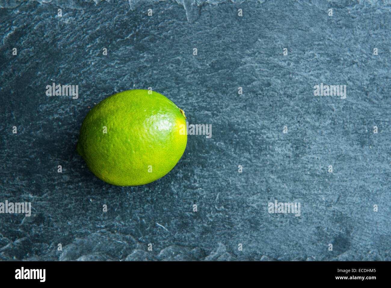 Closeup on lime on stone substrate Stock Photo - Alamy