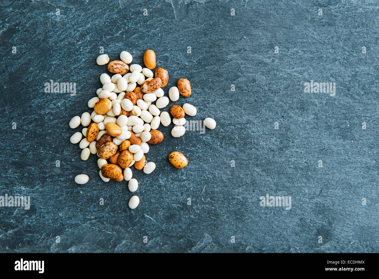 Closeup on beans on stone substrate Stock Photo - Alamy