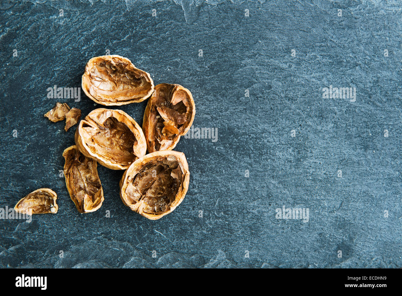 Closeup on walnut shells on stone substrate Stock Photo - Alamy