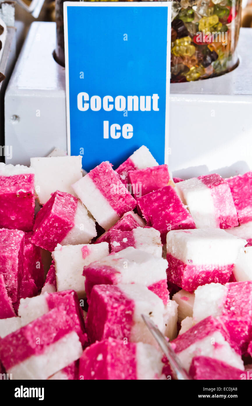 Display of coconut ice sweets at a market Stock Photo - Alamy