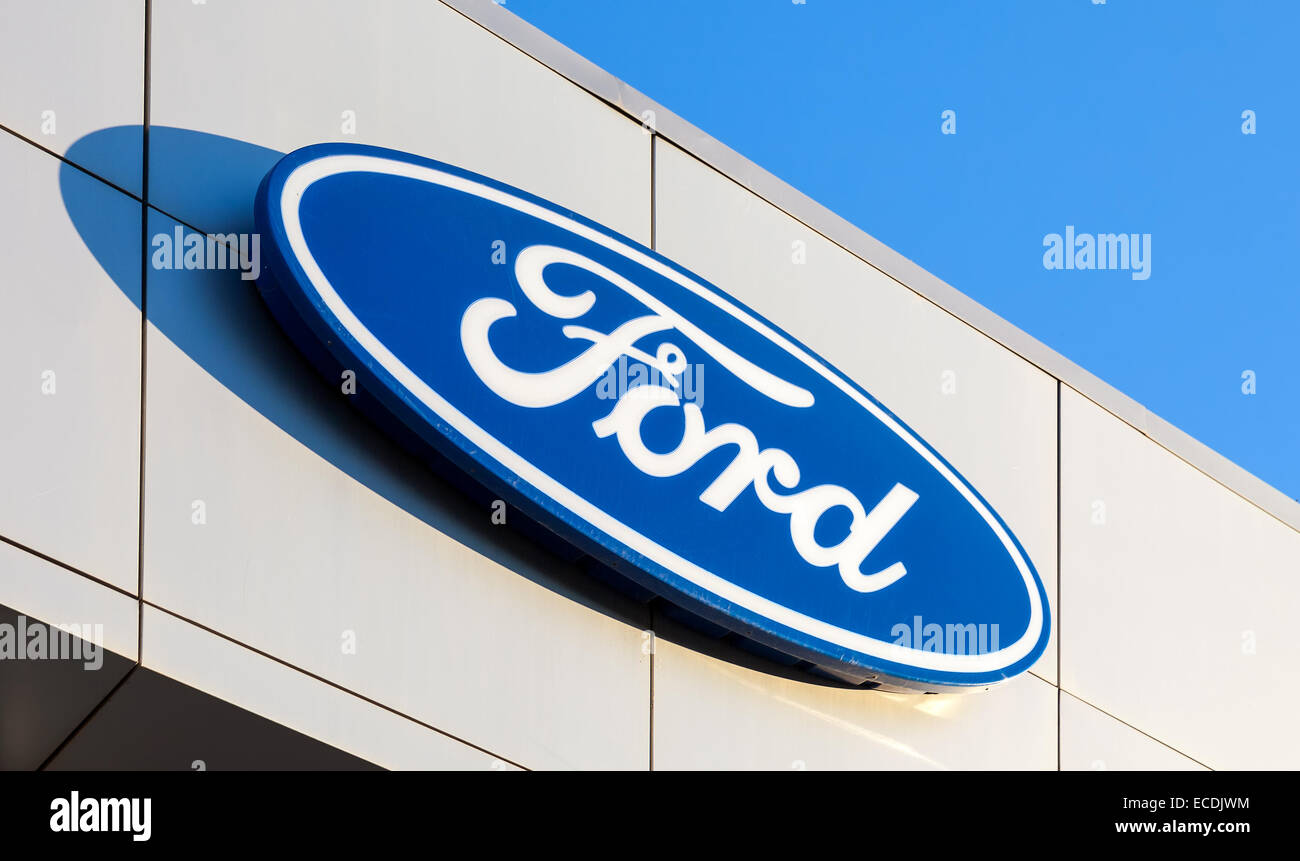 The emblem Ford on the office of official dealer Stock Photo - Alamy
