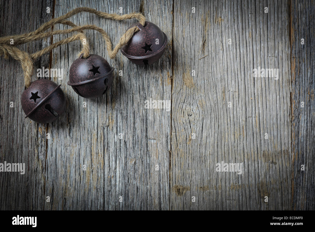 Rustic Christmas Bells and Wood Background Stock Photo - Alamy