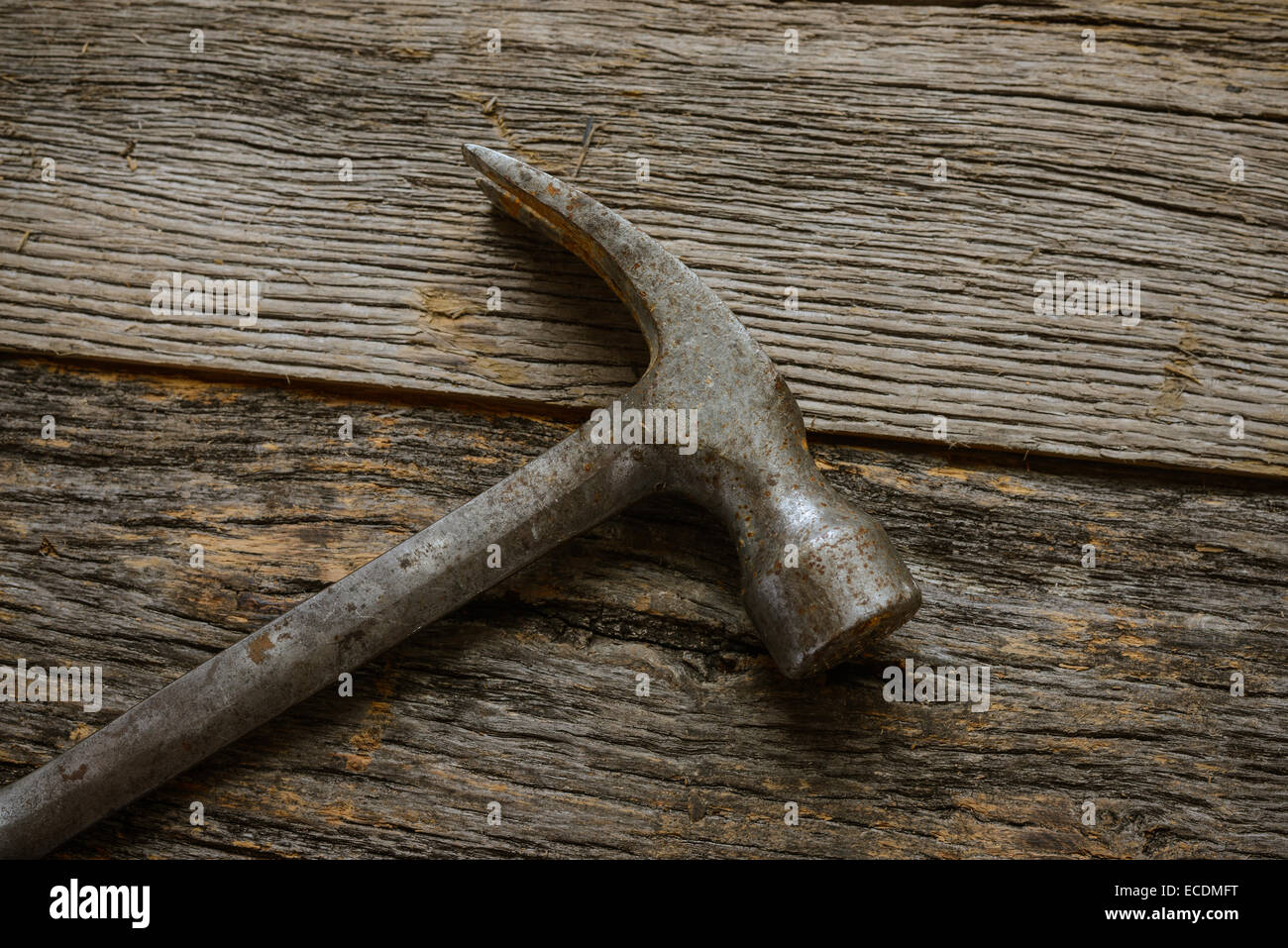 hammer on rustic hardwood floor Stock Photo - Alamy
