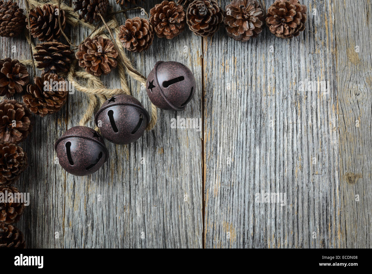 Pine cones and Rustic Bells on an Old Wood Background Stock Photo - Alamy