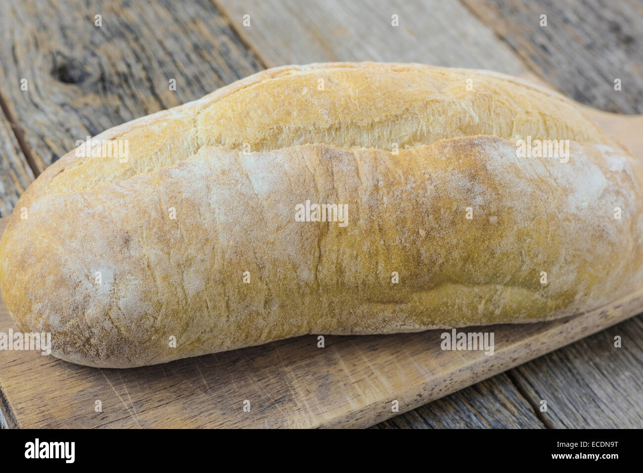 Bread on a Bread Board with Rustic Wood Background Stock Photo - Alamy