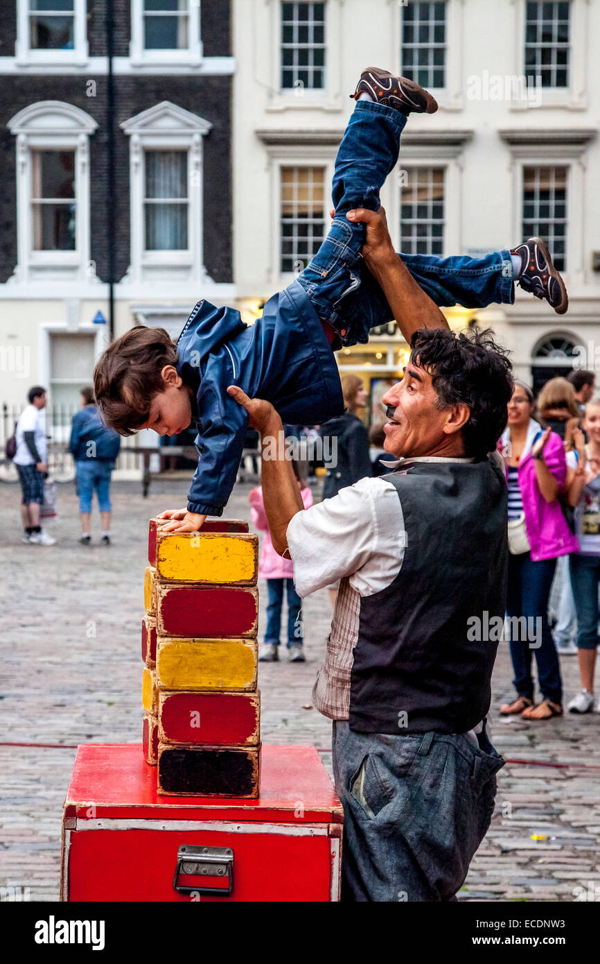 A Street Entertainer Performs In Covent Garden, London, England Stock ...