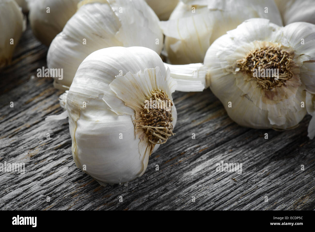 Garlic Bulb Close Up on Rustic Wood Background Stock Photo - Alamy
