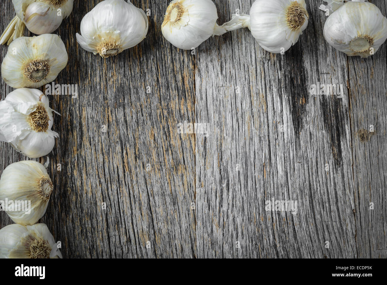 Garlic on Rustic Wood Background Stock Photo - Alamy