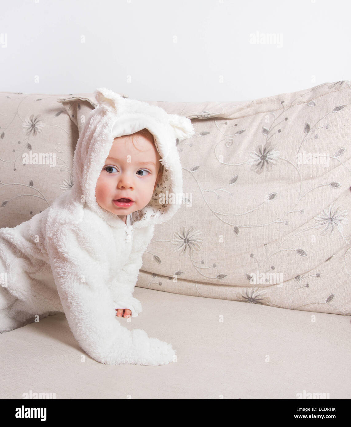 1 year old baby boy dressed in bunny overall at home Stock Photo - Alamy