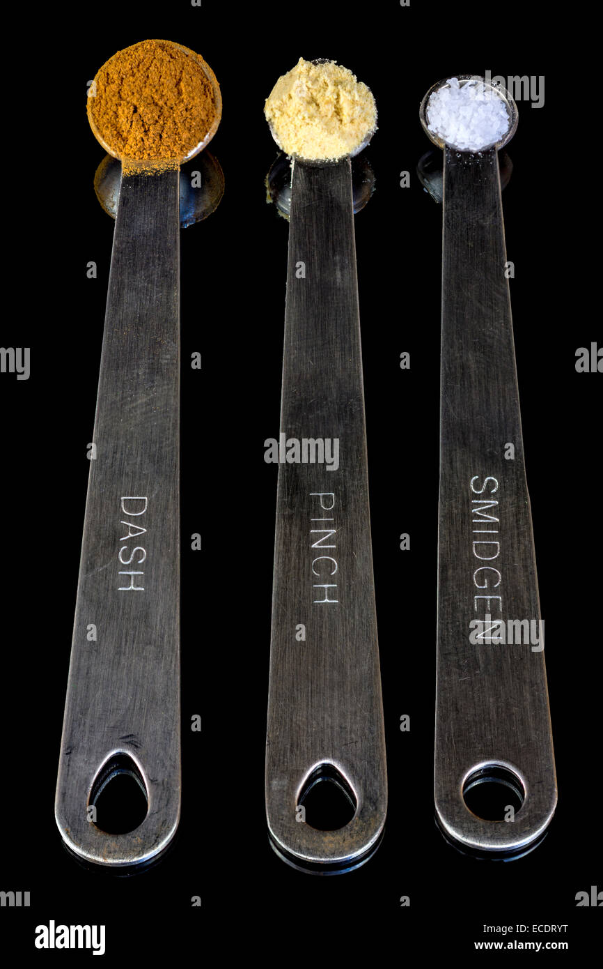 Measuring spoons with ingredients on them Stock Photo - Alamy