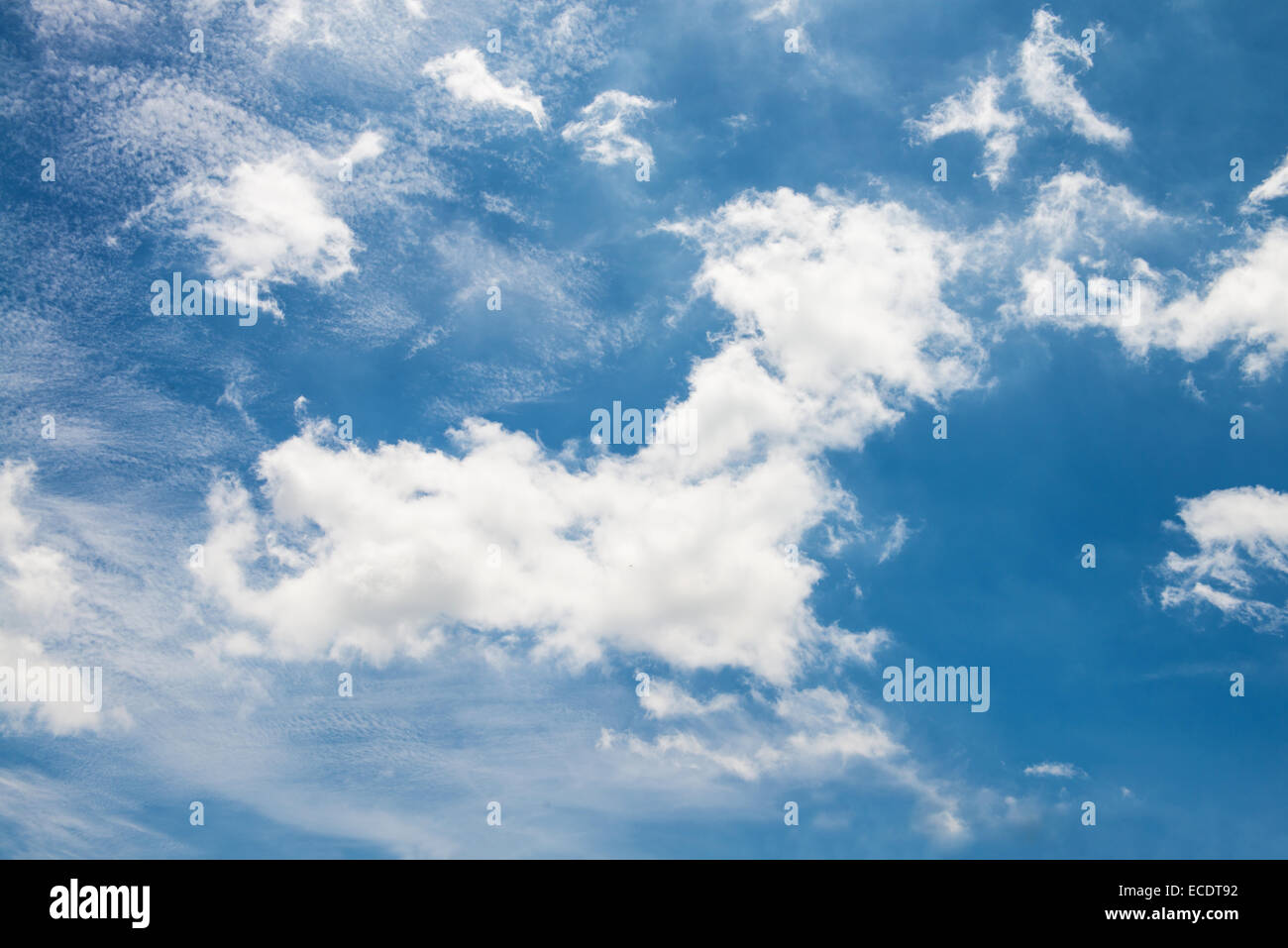 The blue sky and white fluffy clouds Stock Photo - Alamy