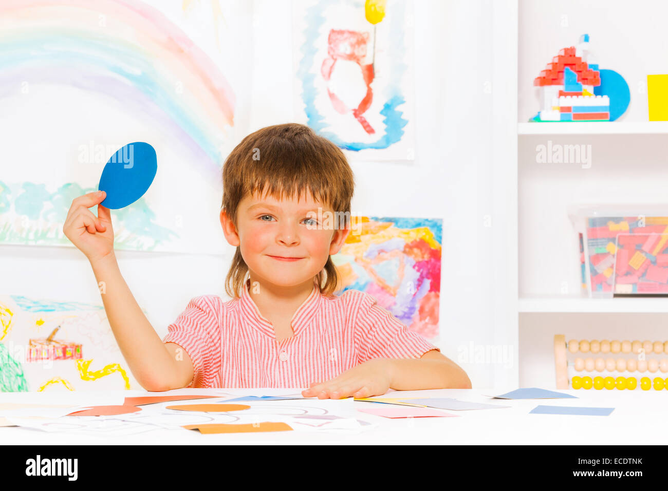 Happy little boy learning shapes in kindergarten Stock Photo - Alamy